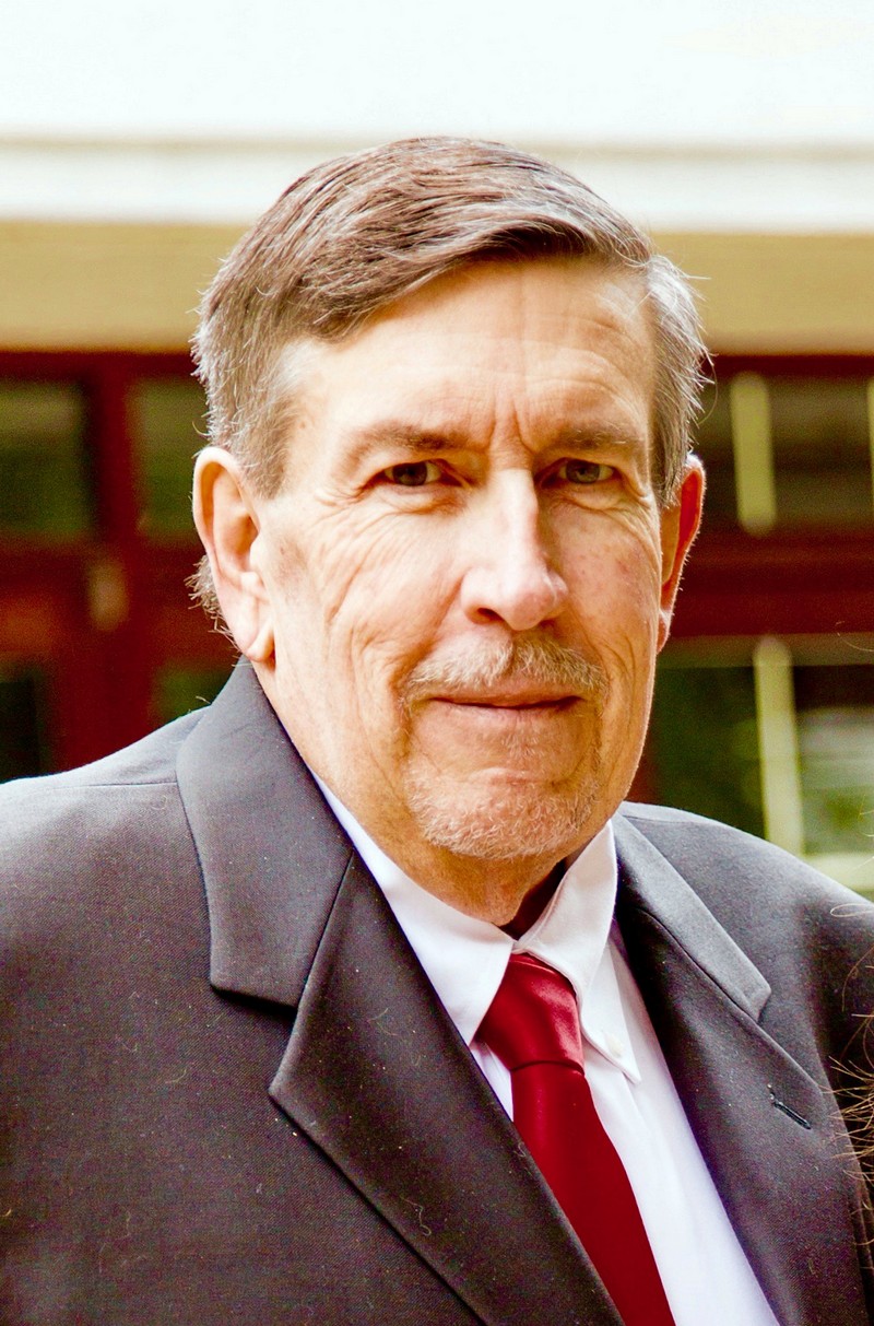 Bruce L. Clark – The Devine News